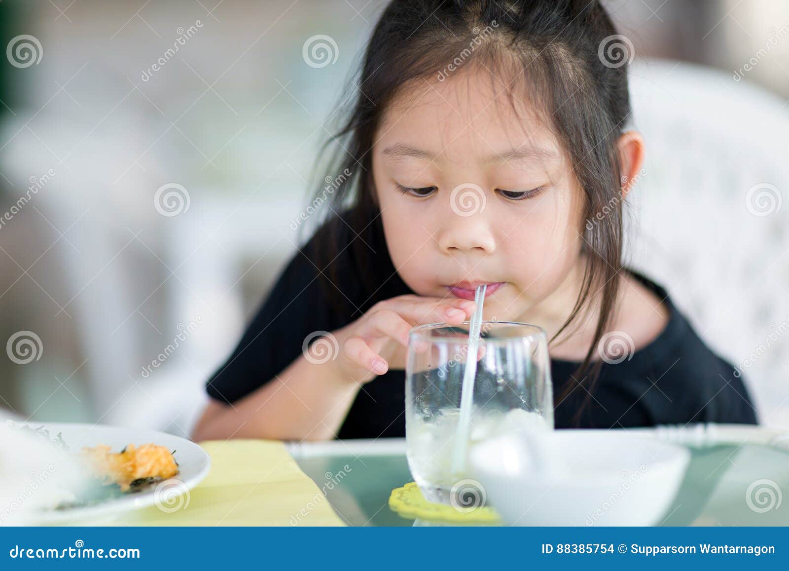 Asian Child Drinking Water Using Straw from Glass Stock Photo - Image ...