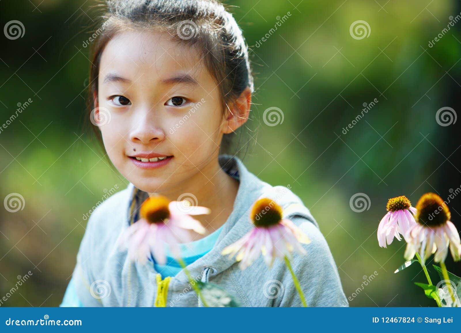 Asian child with flowers stock photo. Image of closeup - 12467824