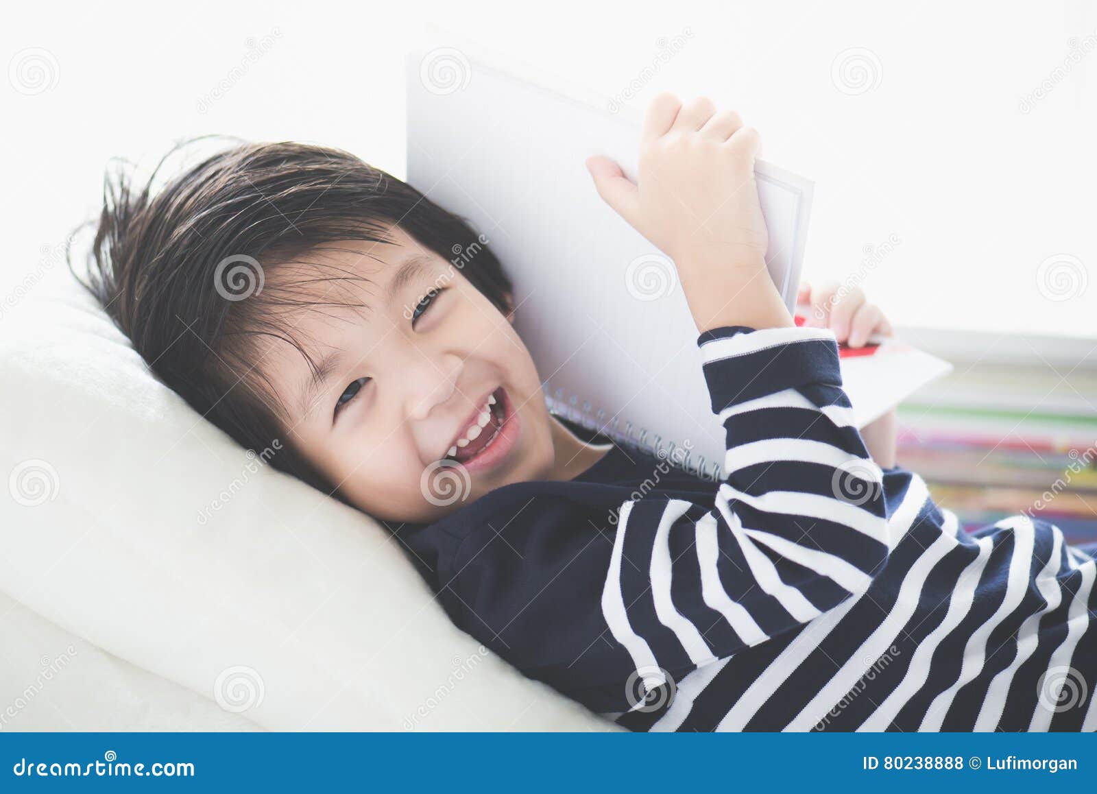 Asian child reading a book stock photo. Image of book - 80238888