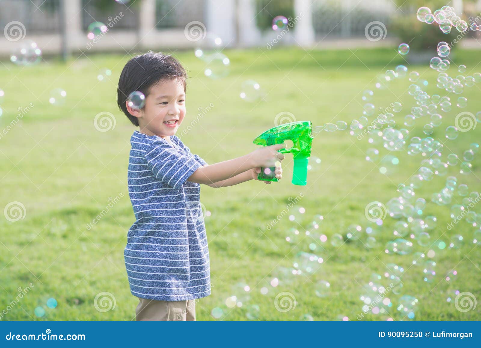 Asian Child Shooting Bubbles from Bubble Gun Stock Photo - Image of ...
