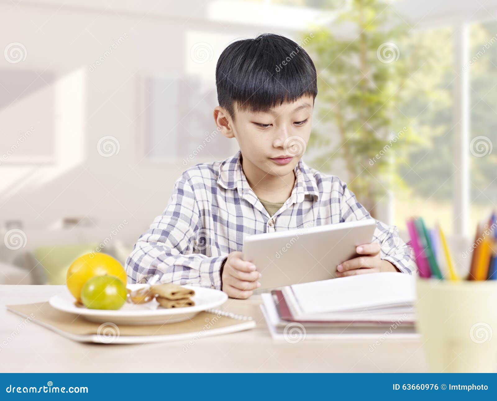 Asian Child Using Tablet Computer Stock Photo - Image of looking, pupil ...