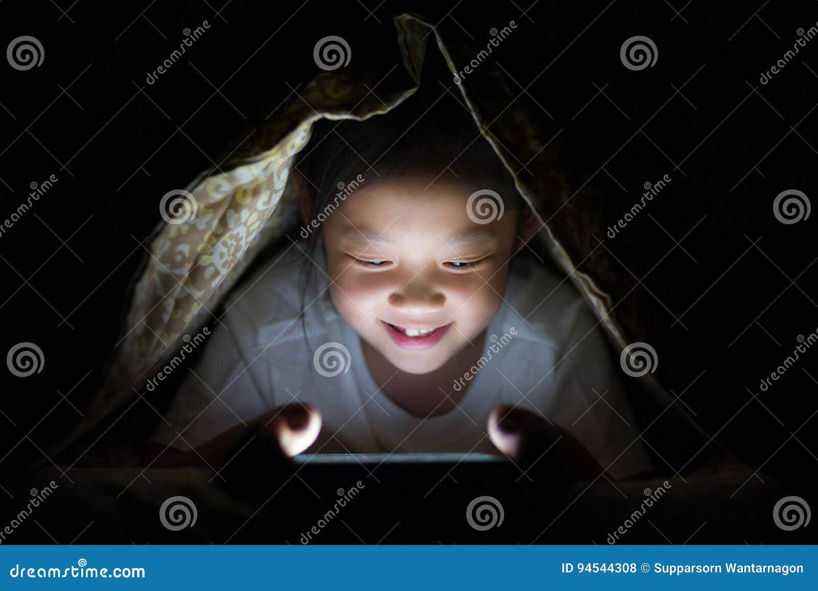 Asian Child Using Tablet PC in Bed at Night Stock Photo - Image of dark ...