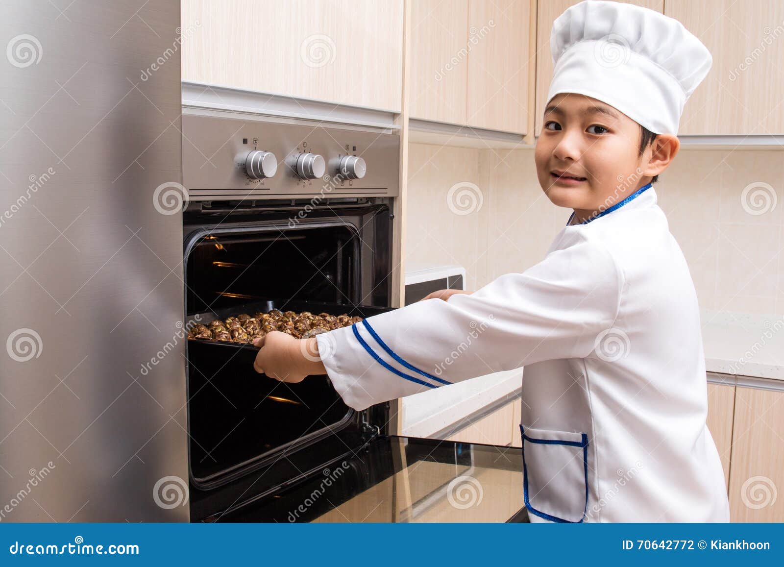Asian Chinese Boy in White Chef Uniform Baking Cookies Stock Photo ...