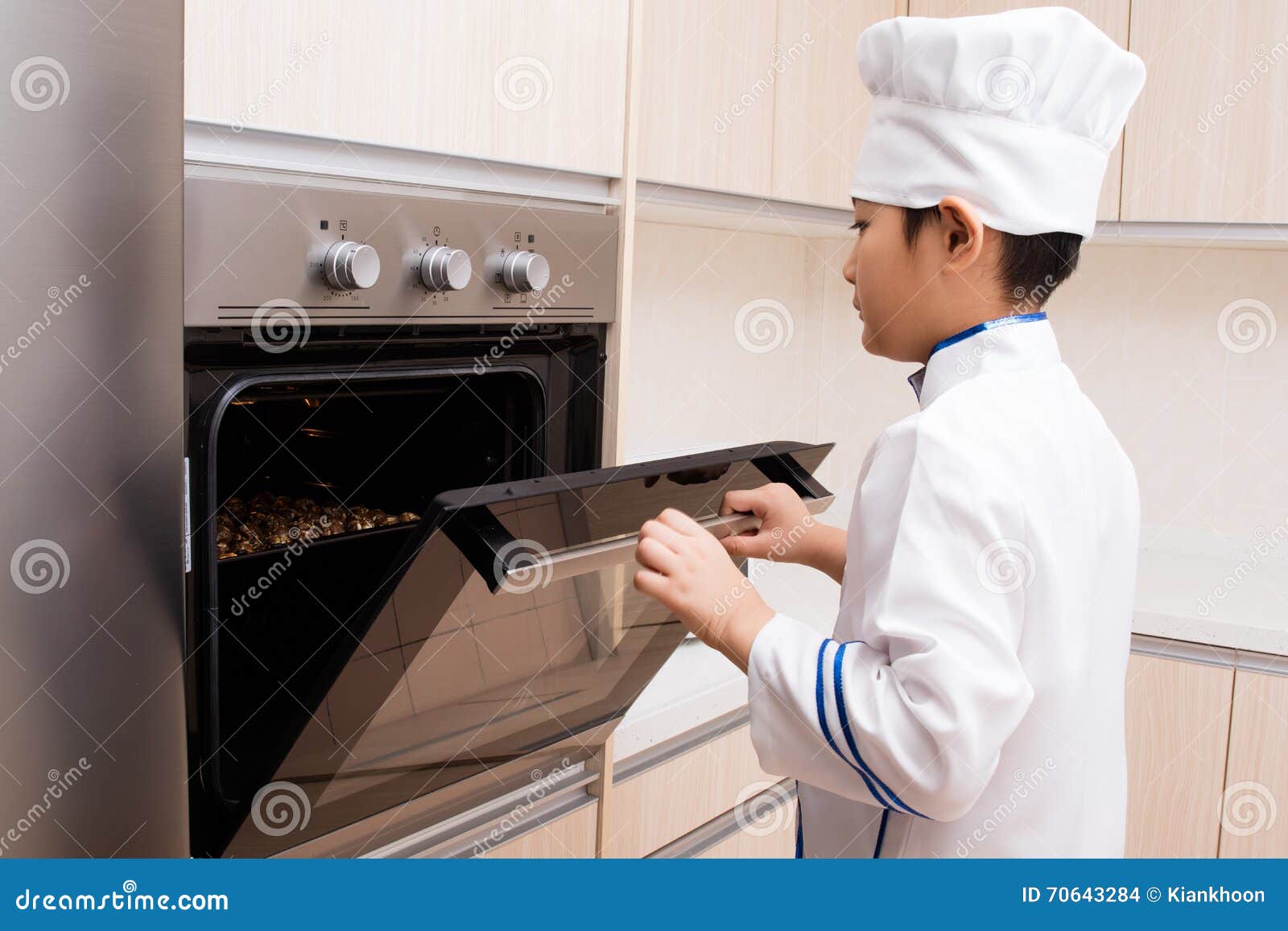 Asian Chinese Boy in White Chef Uniform Baking Cookies Stock Photo ...