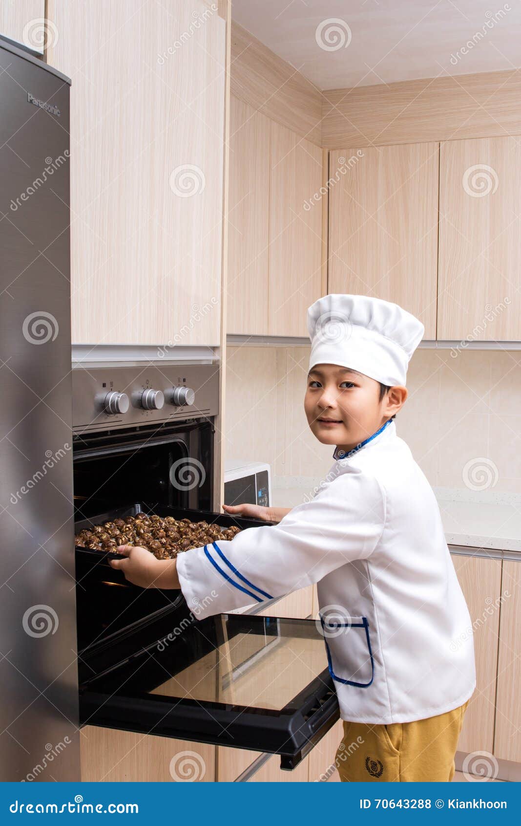 Asian Chinese Boy in White Chef Uniform Baking Cookies Stock Photo ...