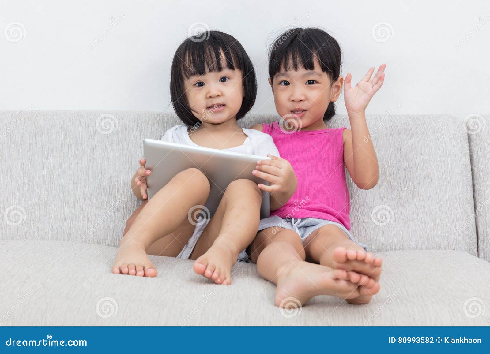 Asian Chinese Little Sisters Using Tablet Stock Photo - Image of device ...