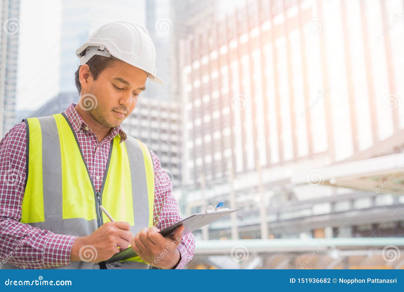 Asian Civil Engineer Working at Building Site. Stock Photo - Image of ...