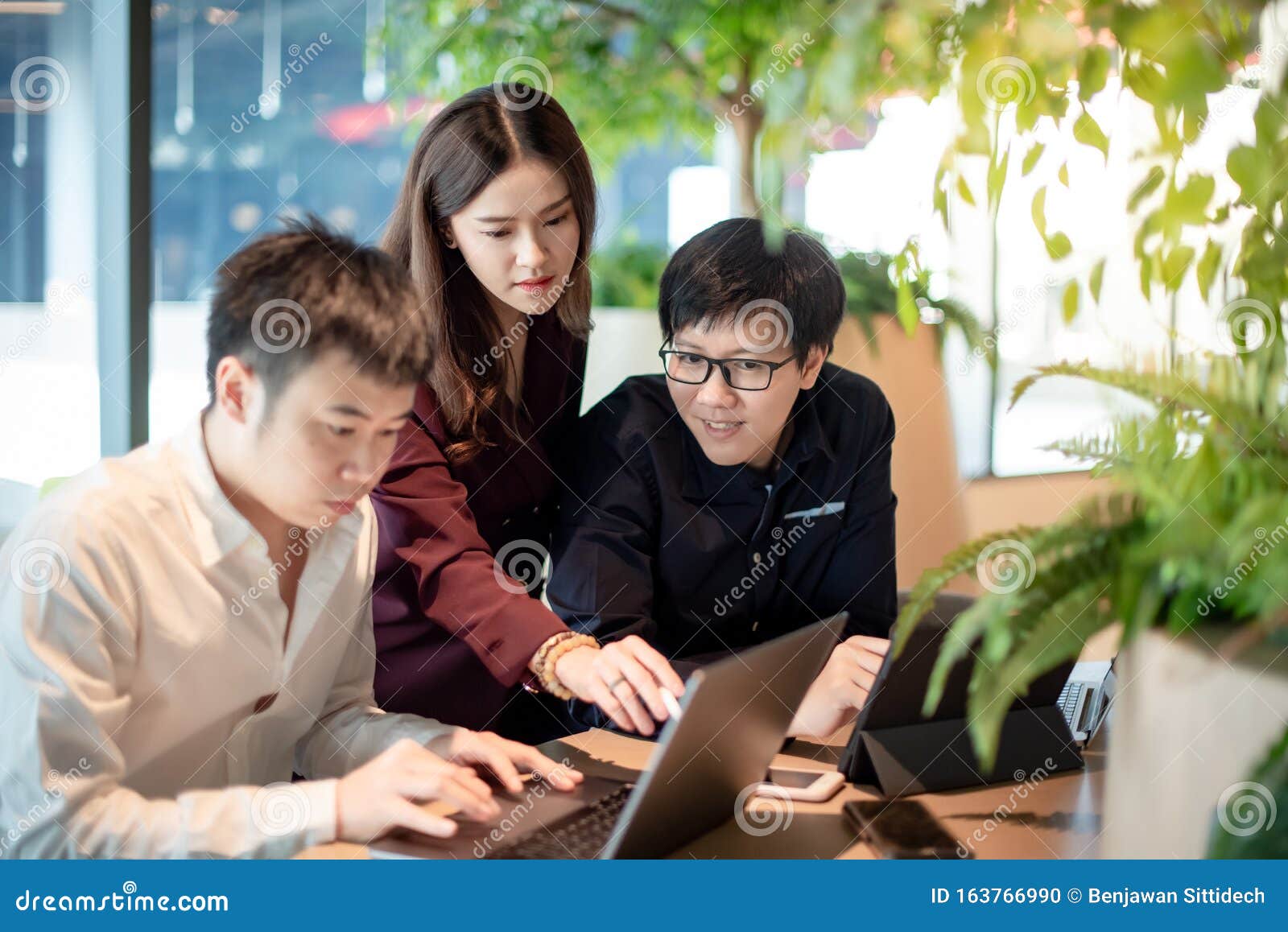 Asian Colleagues Discussing at Workplace Stock Photo - Image of ...