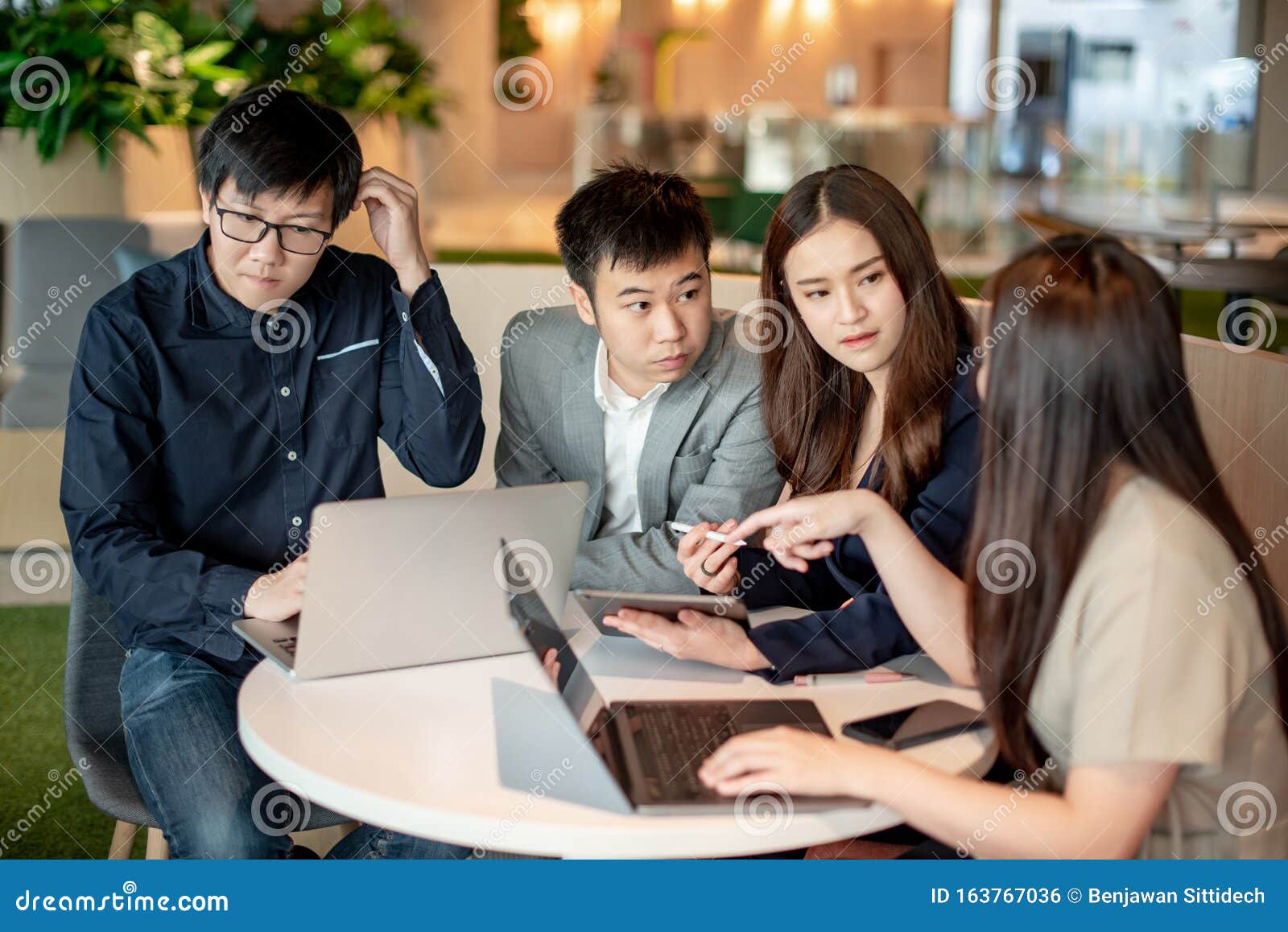 Asian Colleagues Discussing at Workplace Stock Photo - Image of leader ...