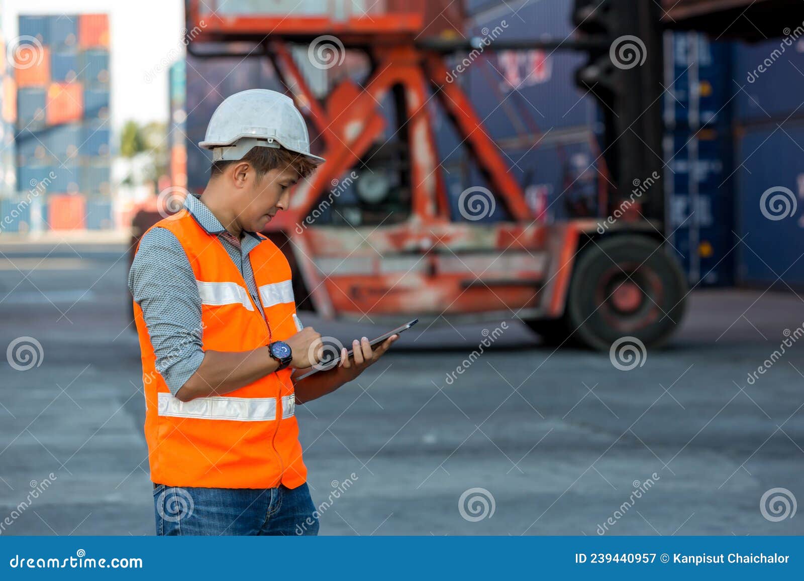 Asian Container Warehouse Worker. Foreman Control Loading Containers ...