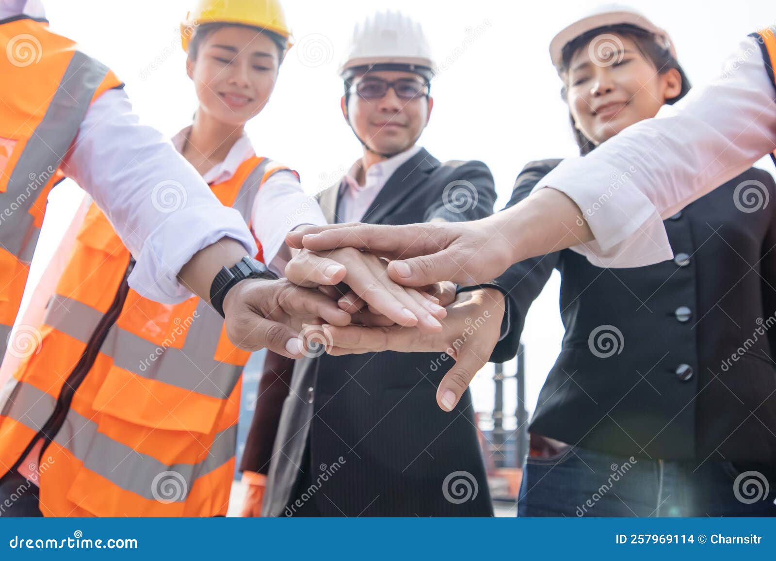 Asian Container Workers Join Hand for Collaboration Stock Photo - Image ...