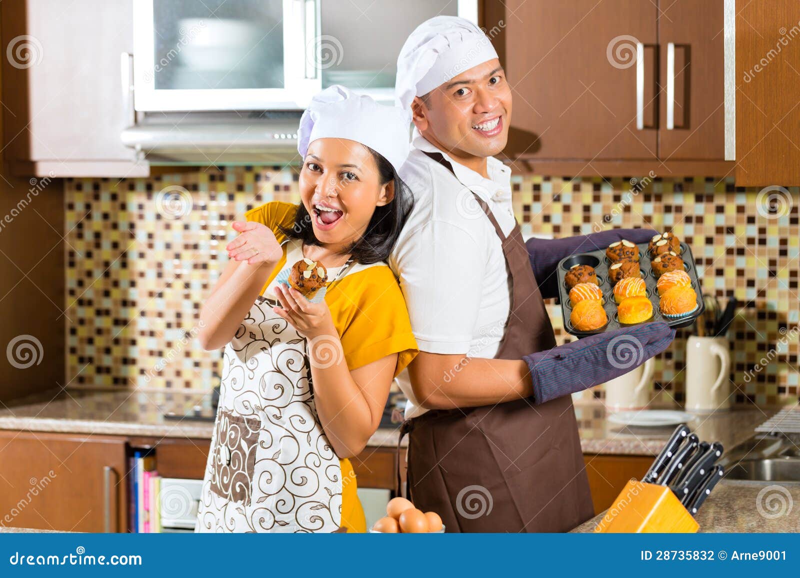 Asian Couple Baking Muffins in Home Kitchen Stock Photo - Image of ...