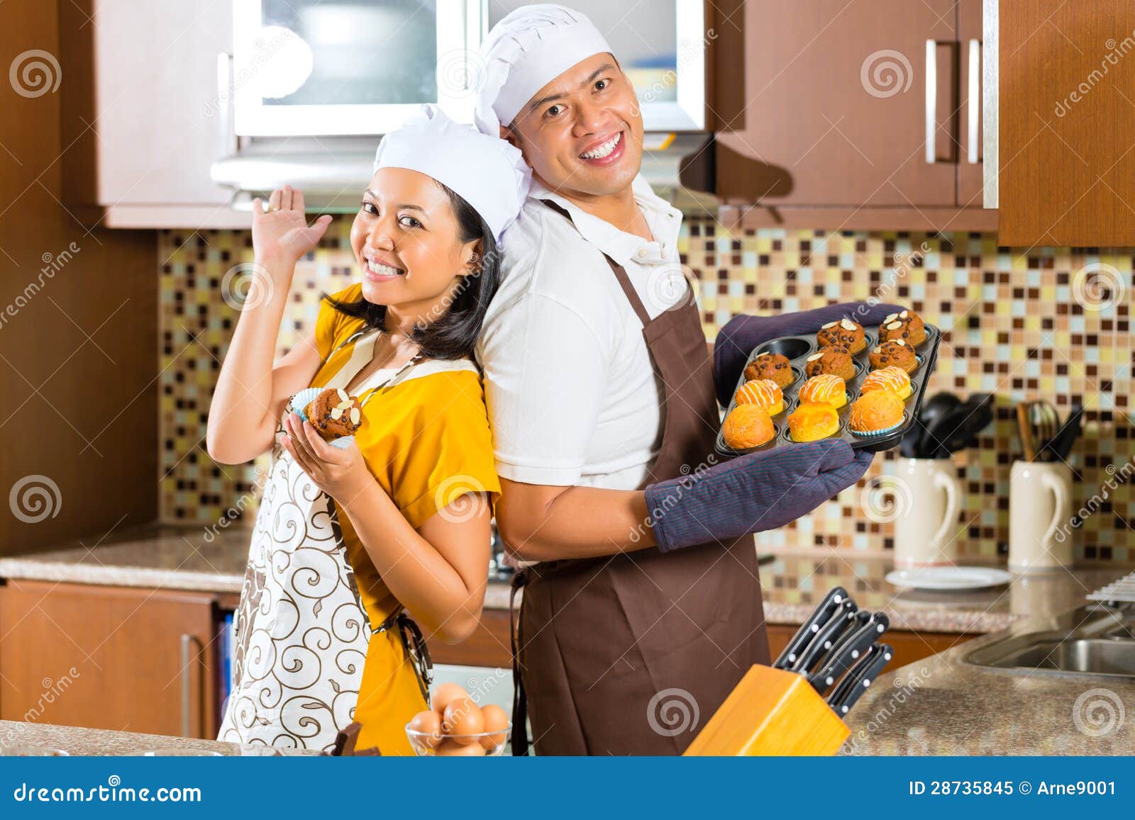 Asian Couple Baking Muffins in Home Kitchen Stock Image - Image of ...