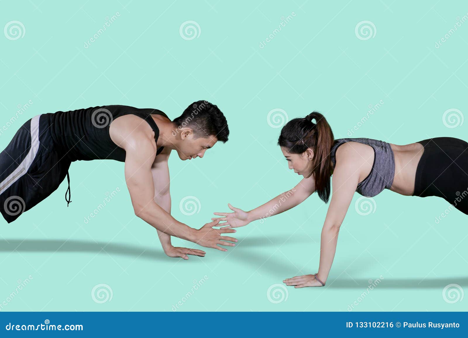 Asian Couple Doing Push Ups Together on Studio Stock Photo - Image of ...