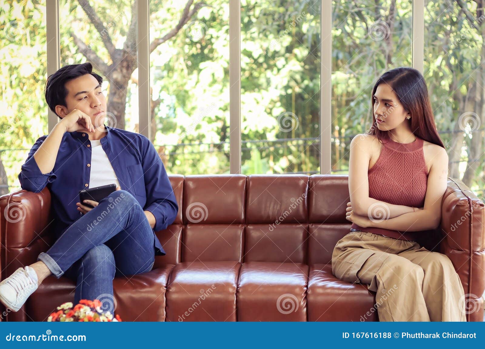 Asian Couple Got Upsetting Man And Woman Sitting On The Other Side Of