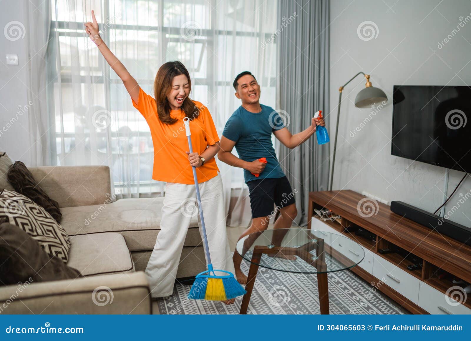 Asian Couple Having Fun while Cleaning House Stock Image - Image of ...