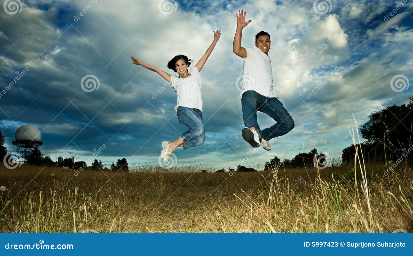 Asian Couple Jumping in Joy Stock Image - Image of jumping, love: 5997423