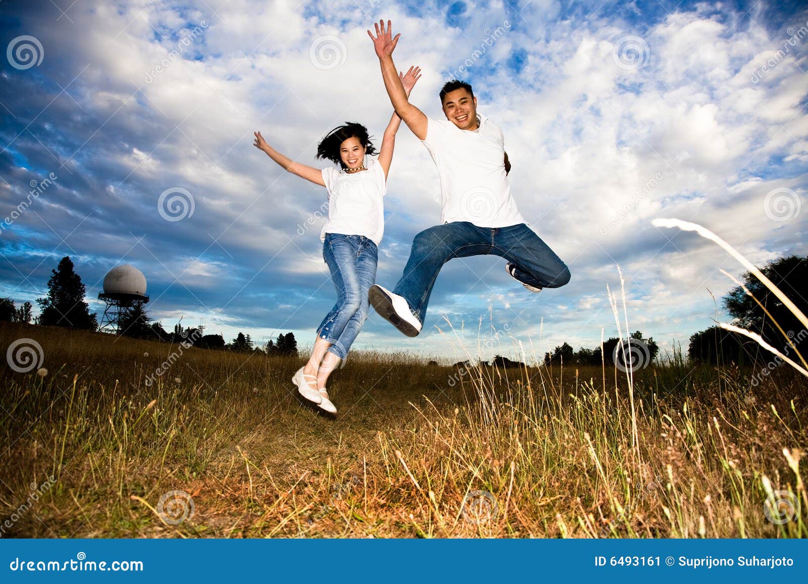 Asian Couple Jumping for Joy Stock Image - Image of love, laugh: 6493161