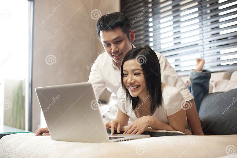 Asian Couple Looking at the Computer Screen Stock Image - Image of ...
