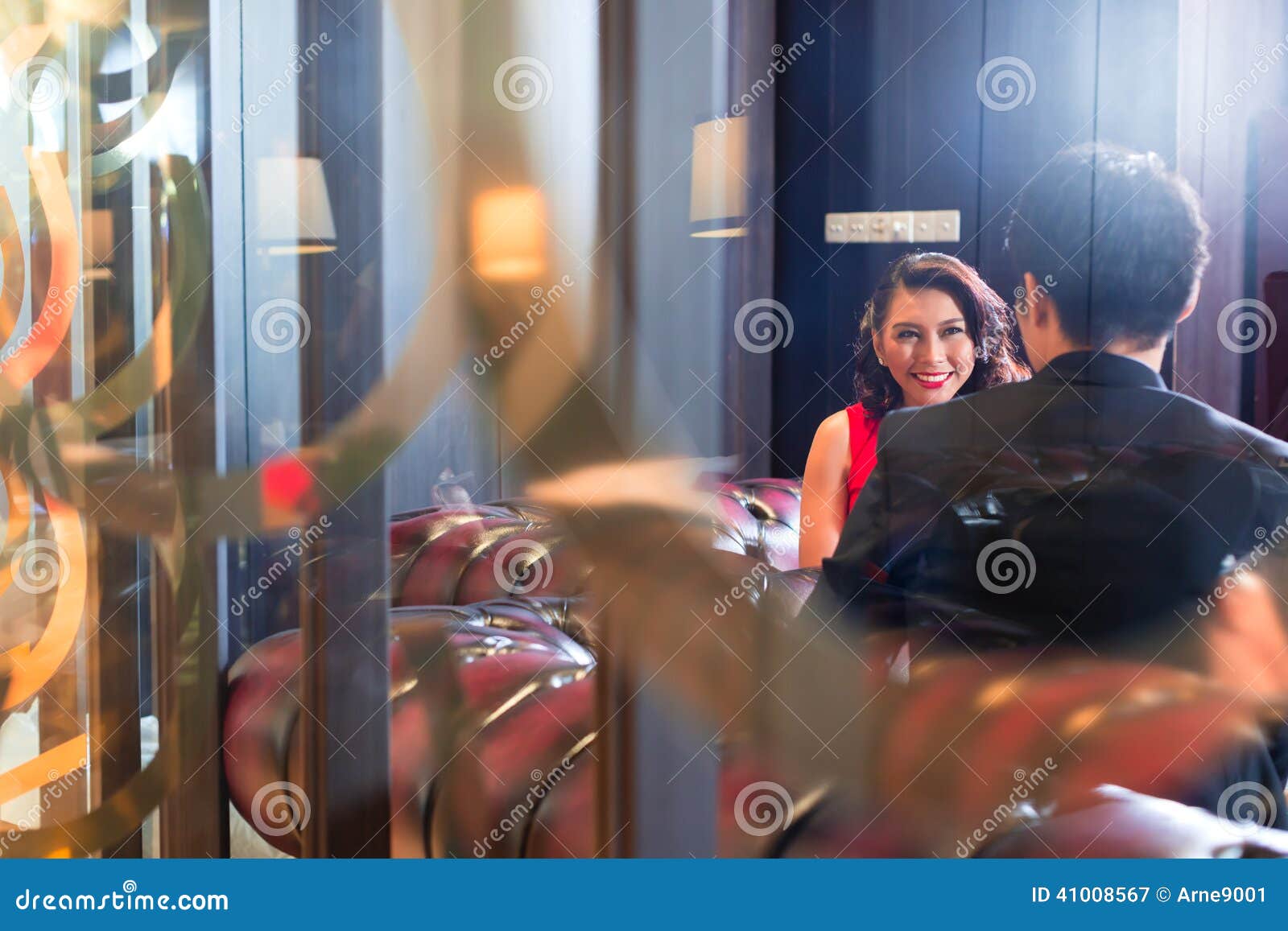 Asian Couple Sitting in Bar Chatting Stock Image - Image of elegant ...