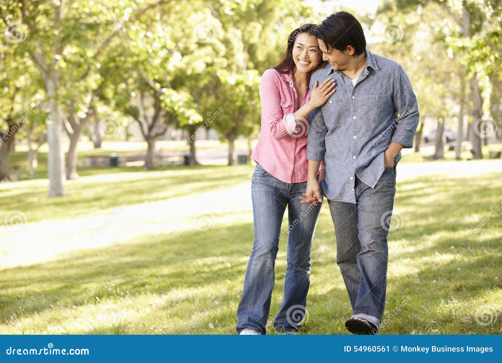 Asian Couple Walking Hand in Hand in Park Stock Image - Image of male ...