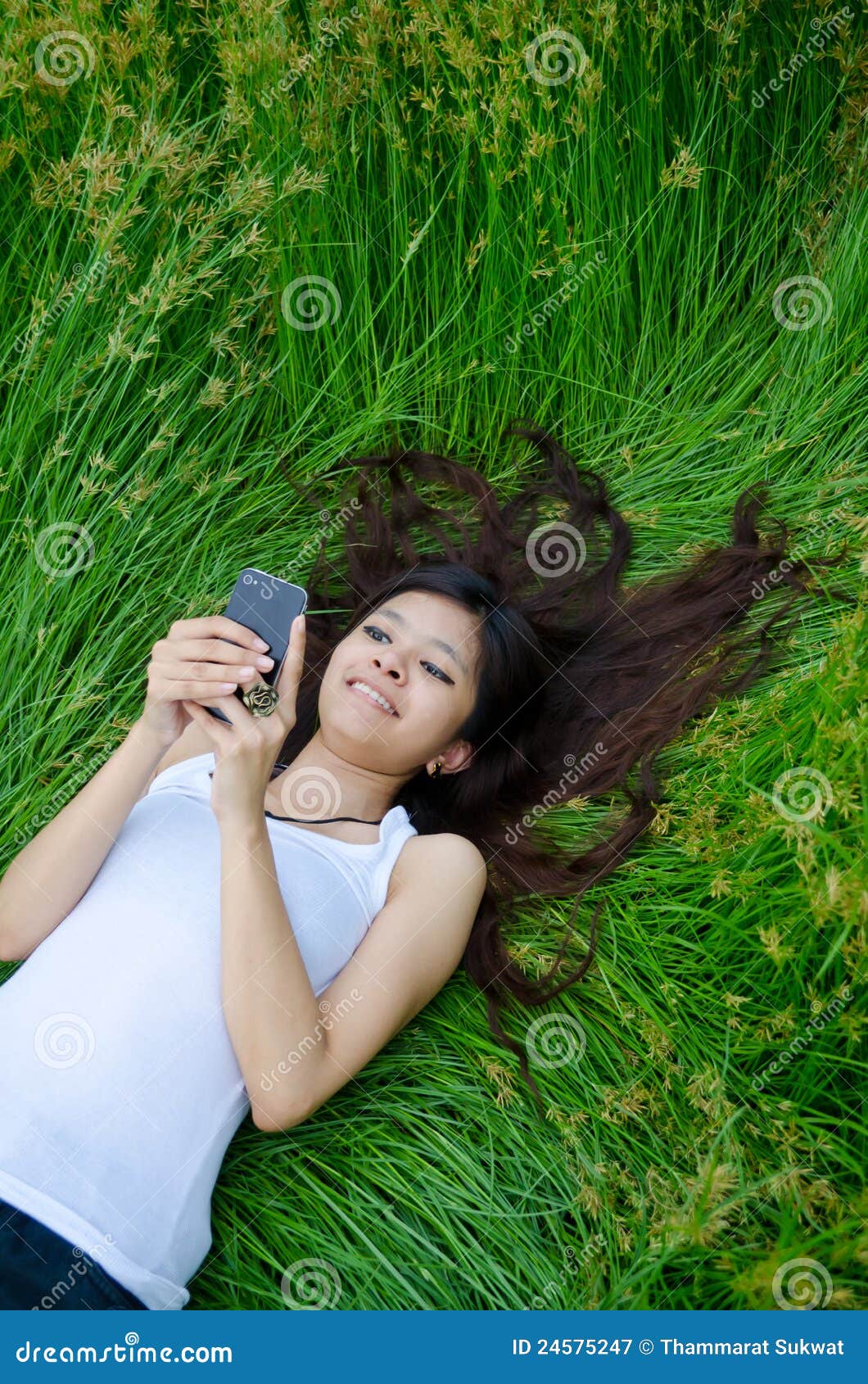 Asian Cute Girl Texting on Meadow Stock Image - Image of black, cell ...