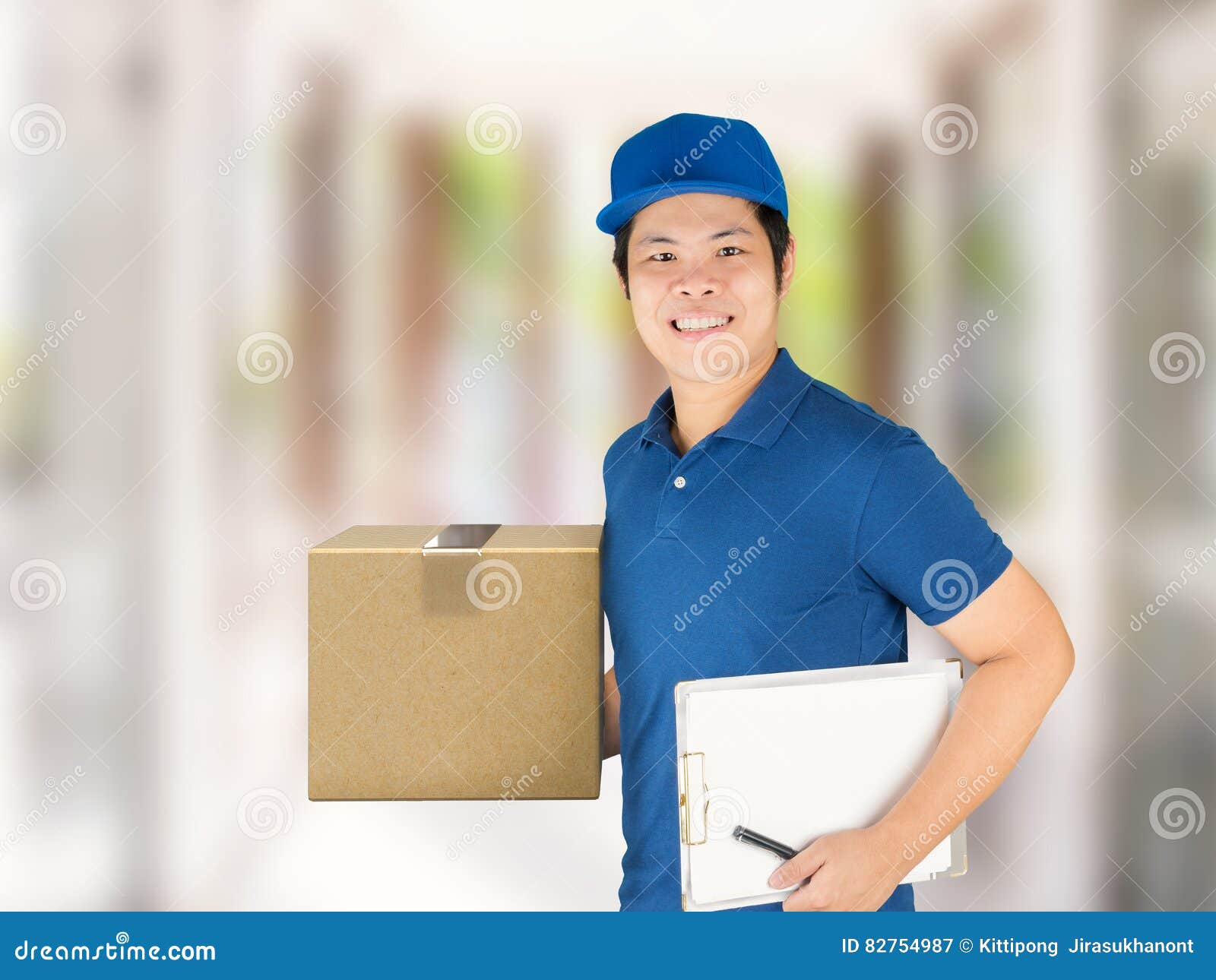 Asian delivery man stock image. Image of postal, notepad - 82754987