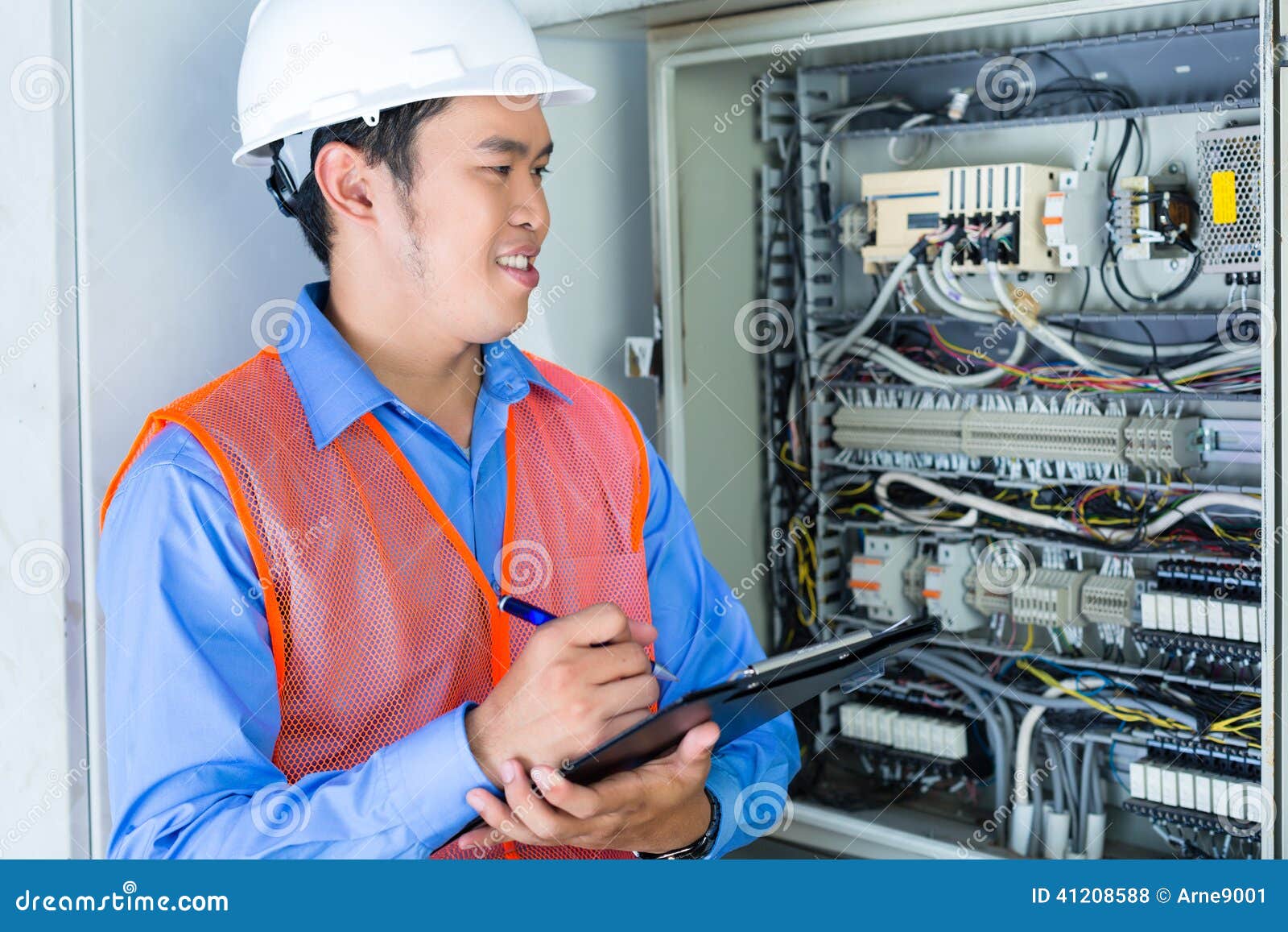 Asian Electrician at Panel on Construction Site Stock Photo - Image of ...