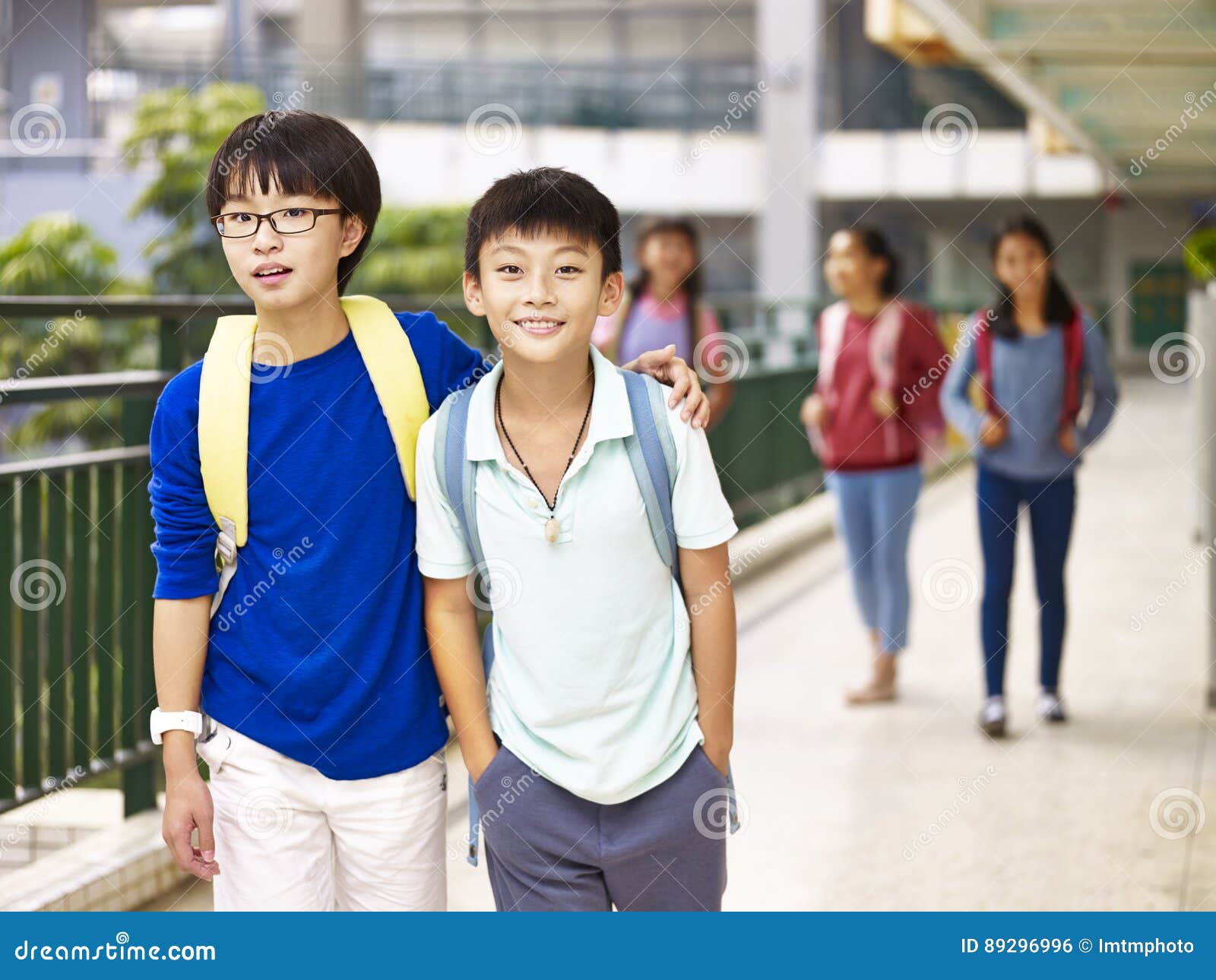 Asian Elementary School Student Walking on Campus Stock Photo - Image ...