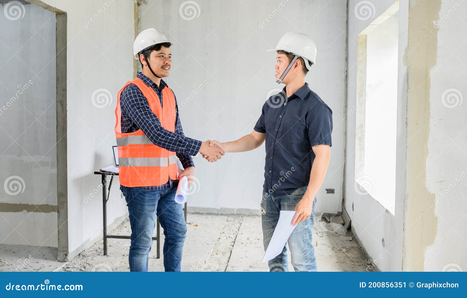 Asian Engineer and Architect Handshake at Construction Property Site ...