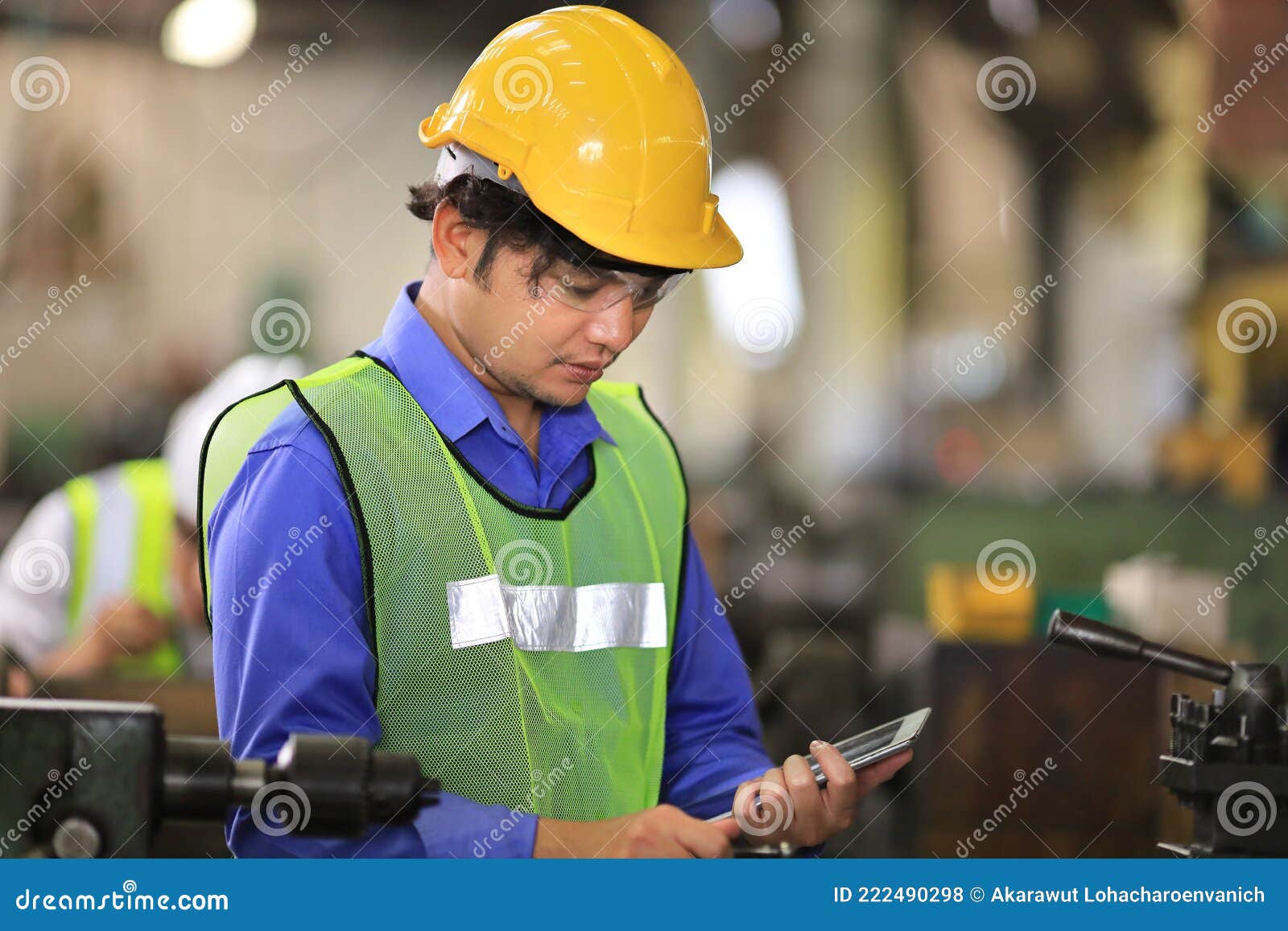 Asian Engineering Manager in Safety Hard Hat and Reflective Cloth is ...