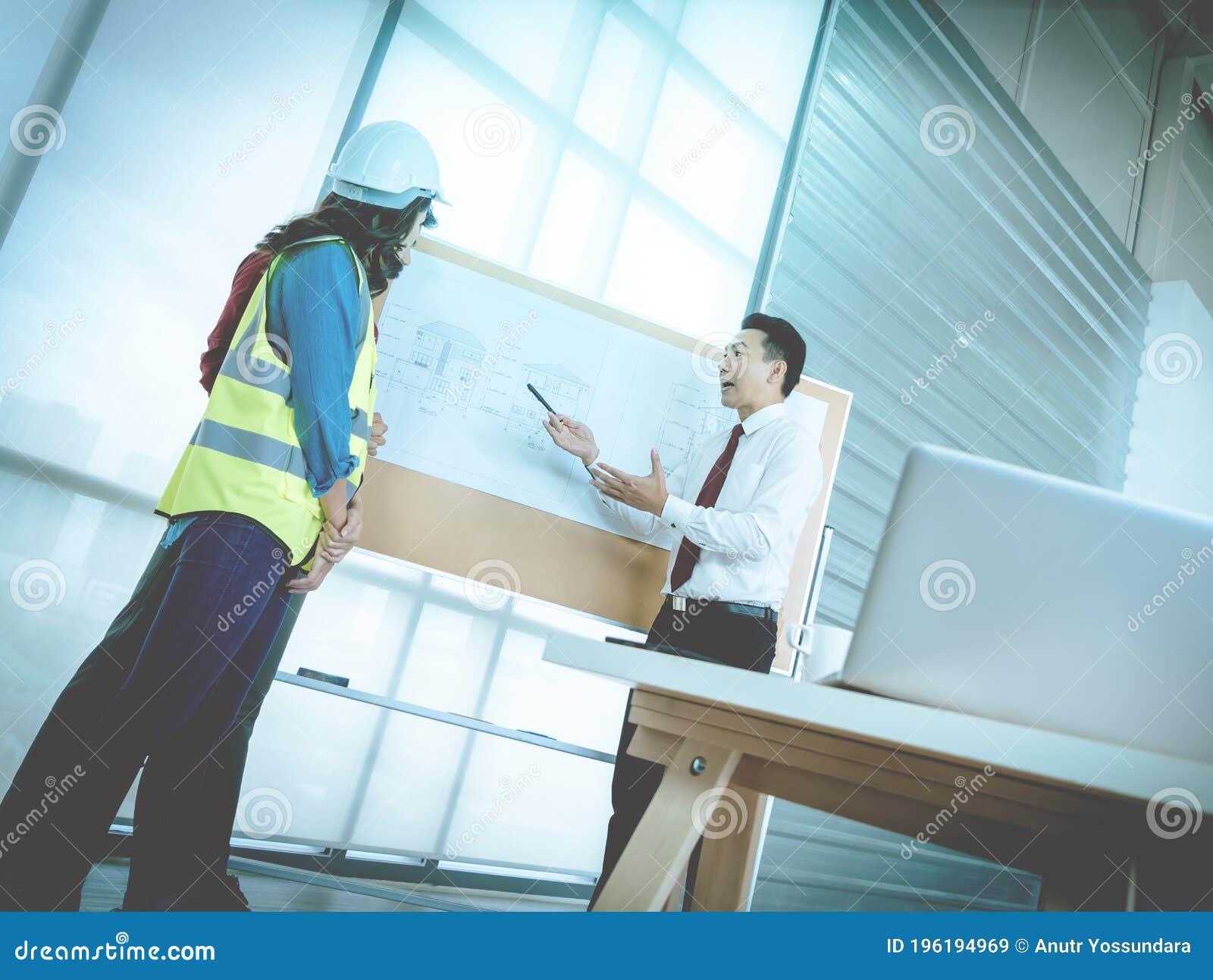 Engineering Team Having a Meeting on Construction Plan in Construction ...