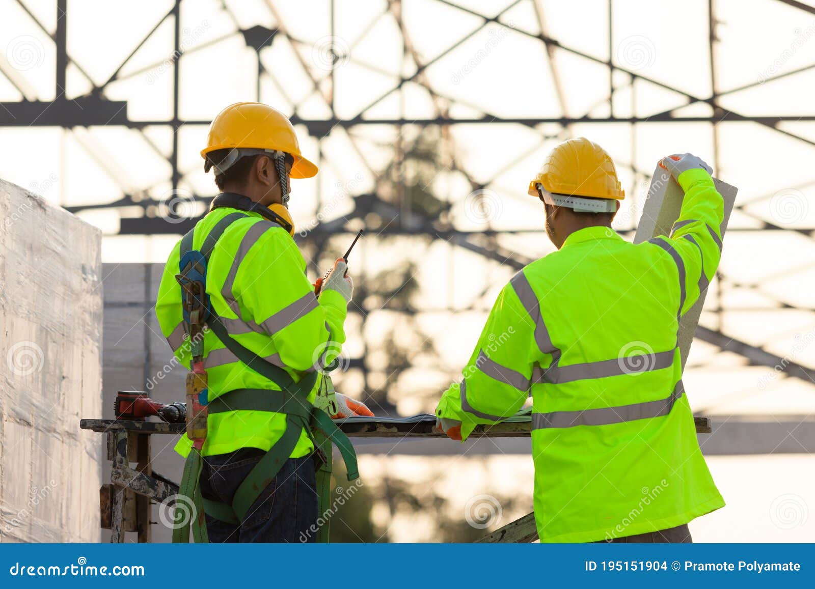 Asian Engineers And Consultant Workers Calculate The Amount Of Bricks ...
