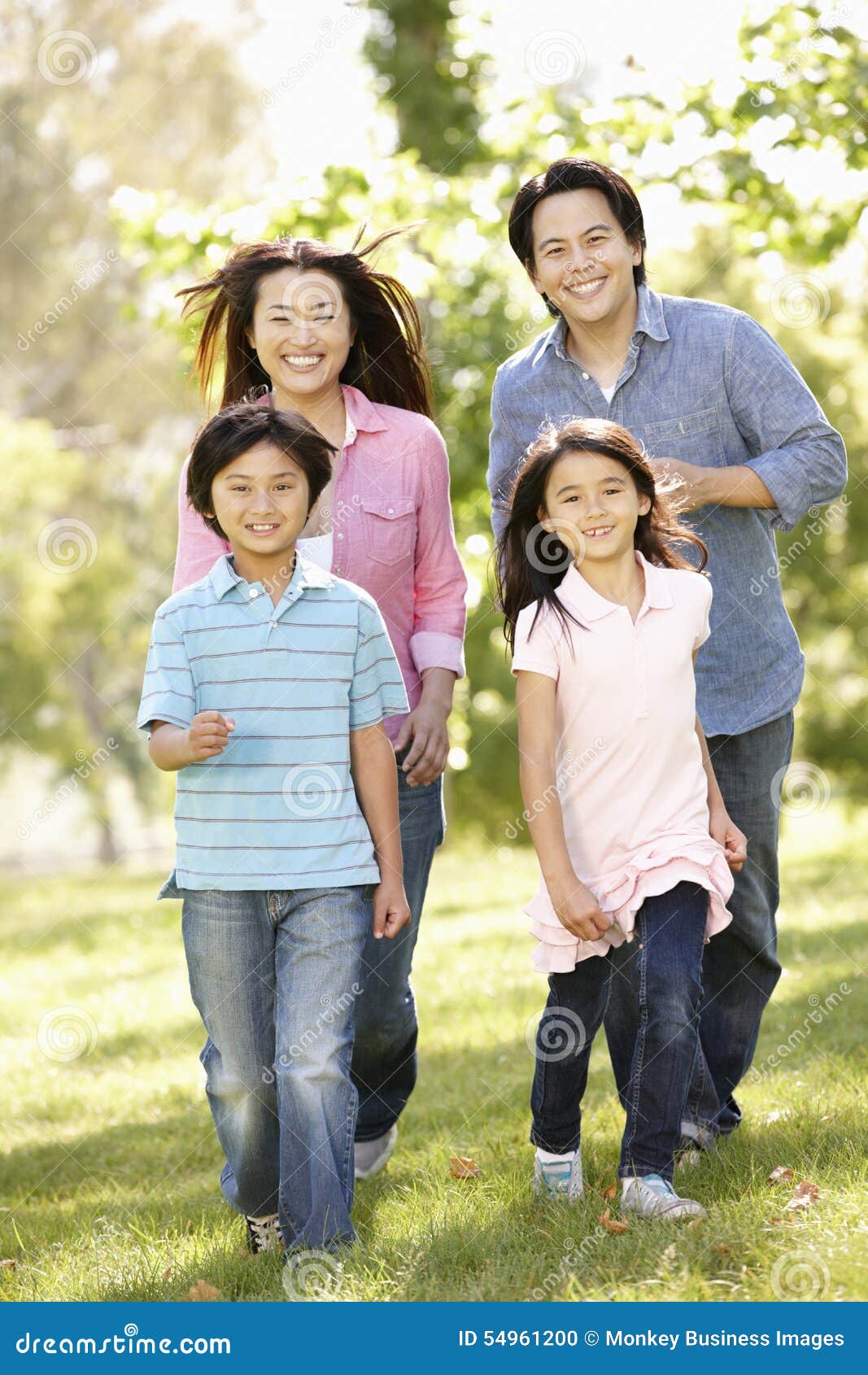 Asian Family Running in Park Stock Photo - Image of thirties, people ...