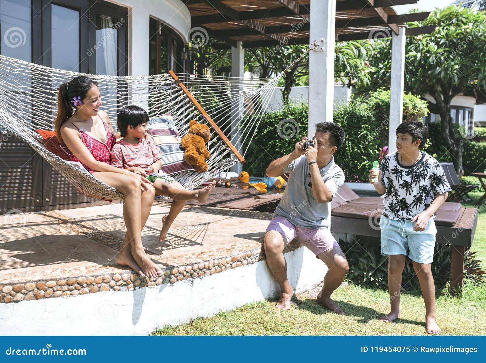 Family Spending Nice Time Together At Home, Looks Happy And Cheerful ...