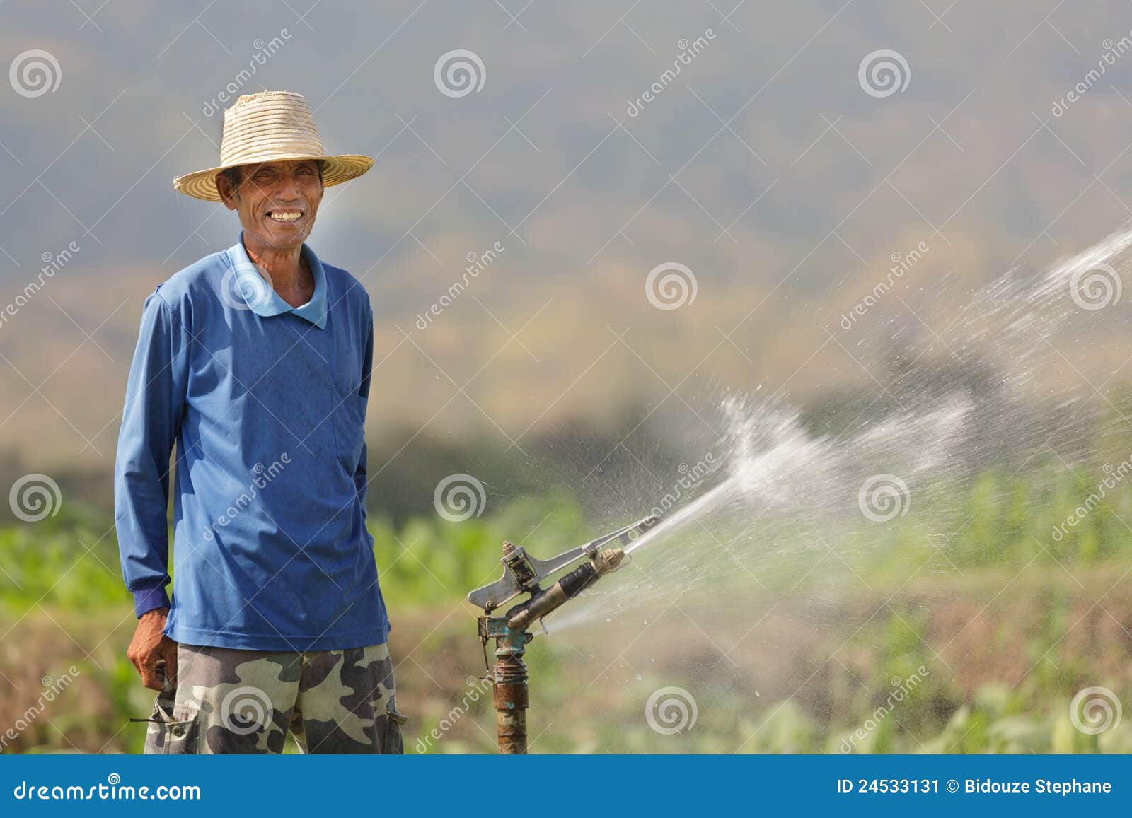 Asian Farmer Throwing Rice Seed By Hand On Wet Mud In Rice Field ...