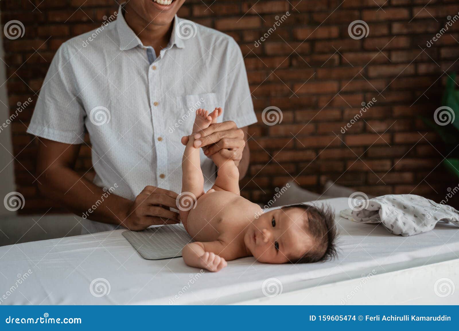 Asian Father Rubbing Baby Buttocks Stock Photo - Image of infant ...