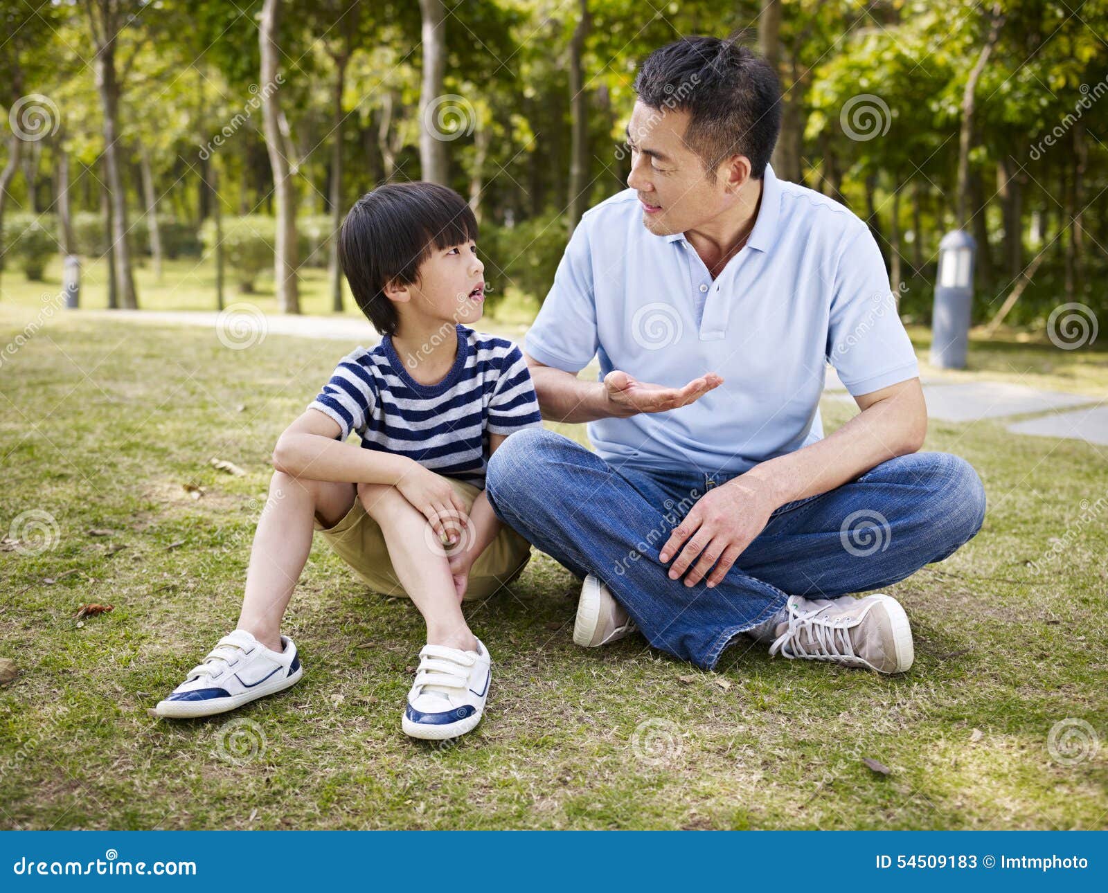 Asian Father and Son Having a Conversation Stock Image - Image of ...