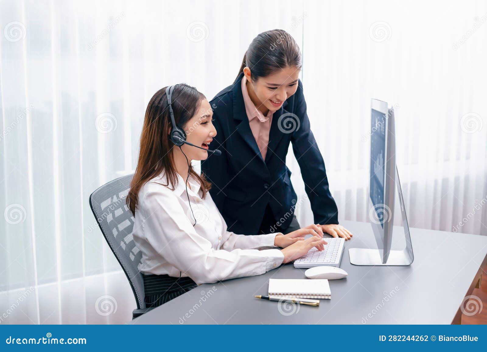 Asian Female Customer Support Operator Guided by Manger Enthusiastic ...