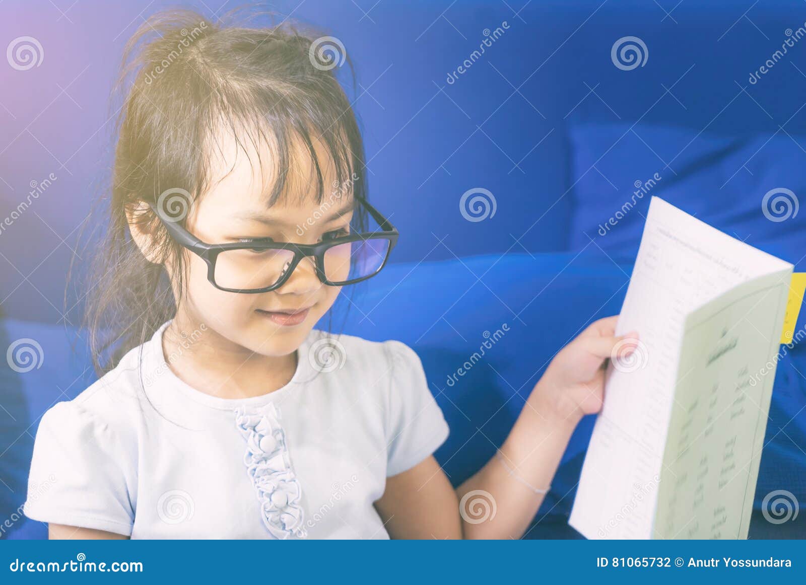 Asian Female Kid is Reading a Book Studying. Stock Photo - Image of ...