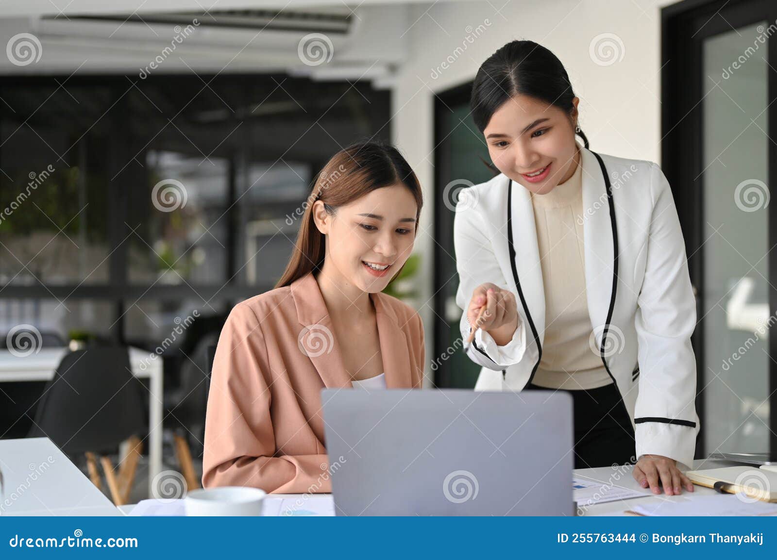 Asian Female Manager or Female Boss Helping, Coaching and Training Her ...