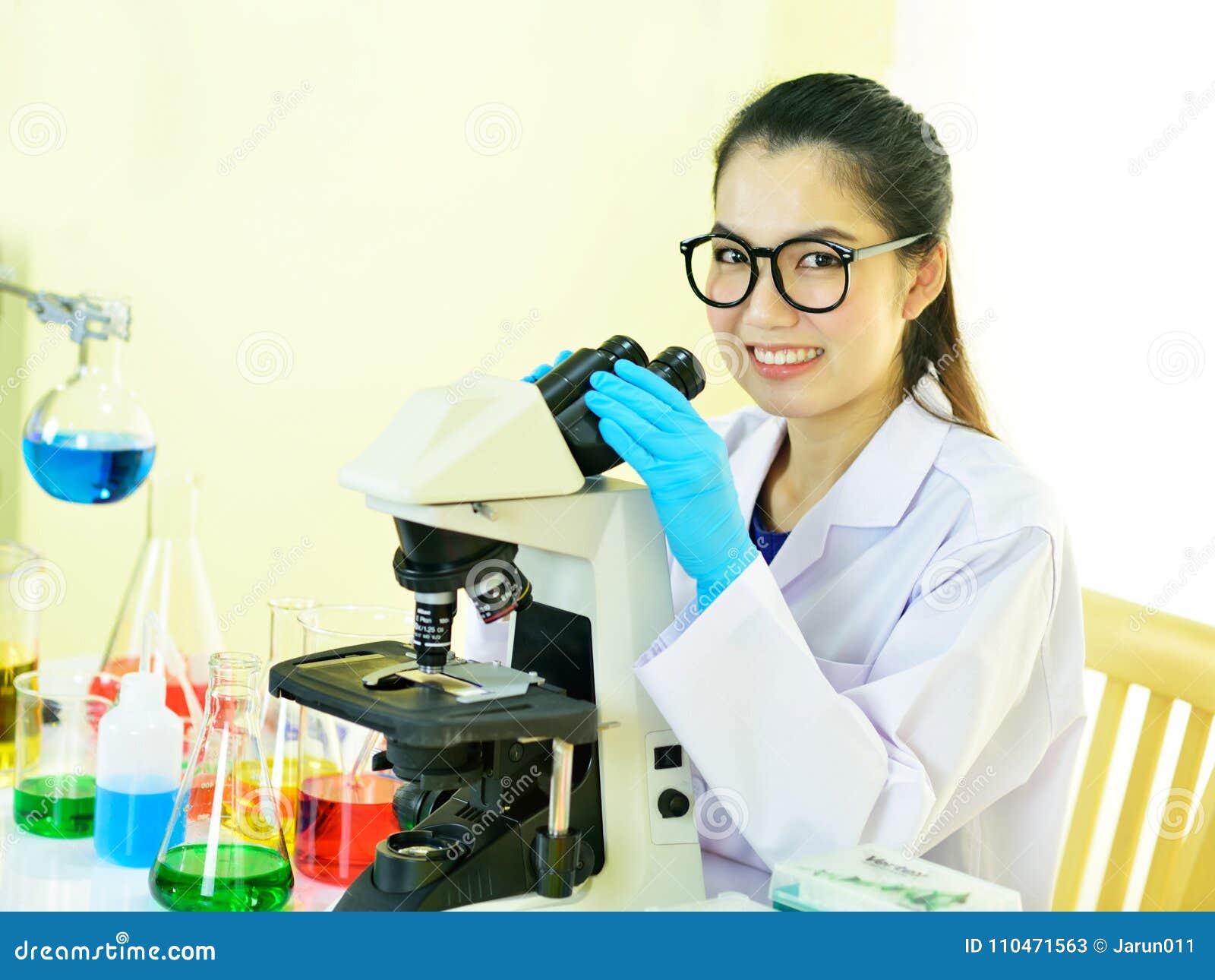 Medical Technologist Working with Microscope Stock Image - Image of ...