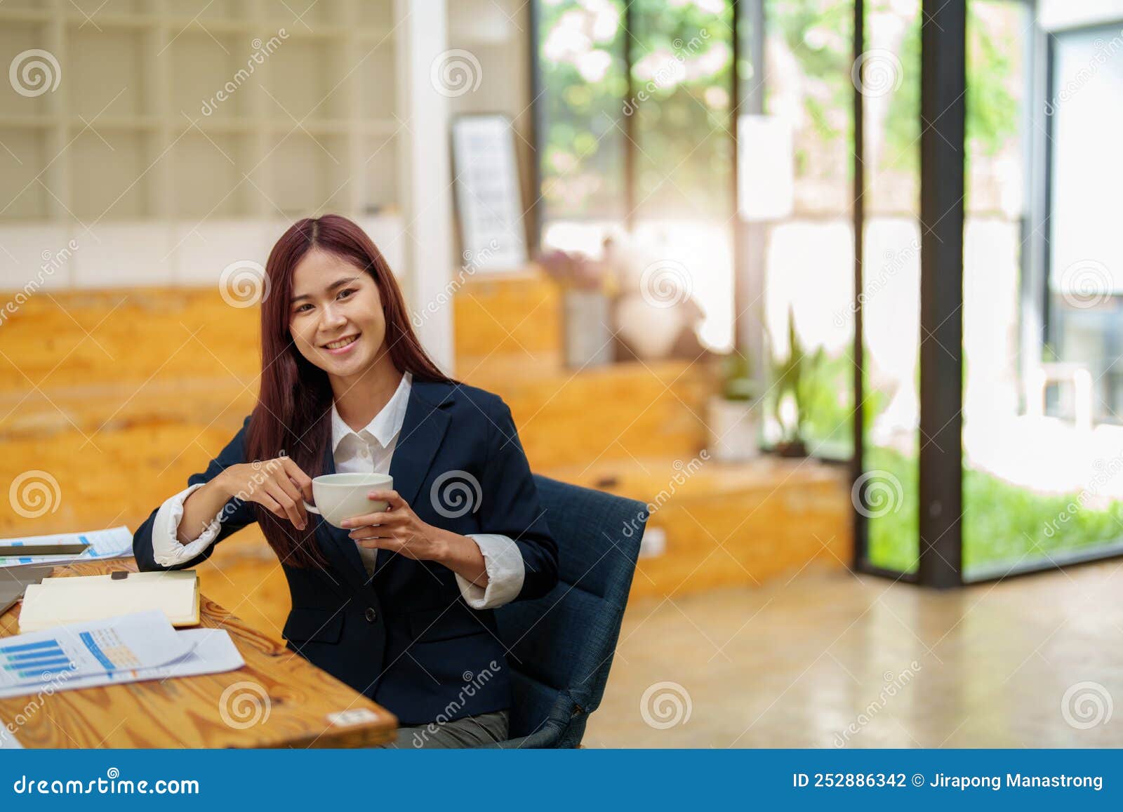 Asian Female Worker Using Computer and Budget Documents on Desk Stock ...