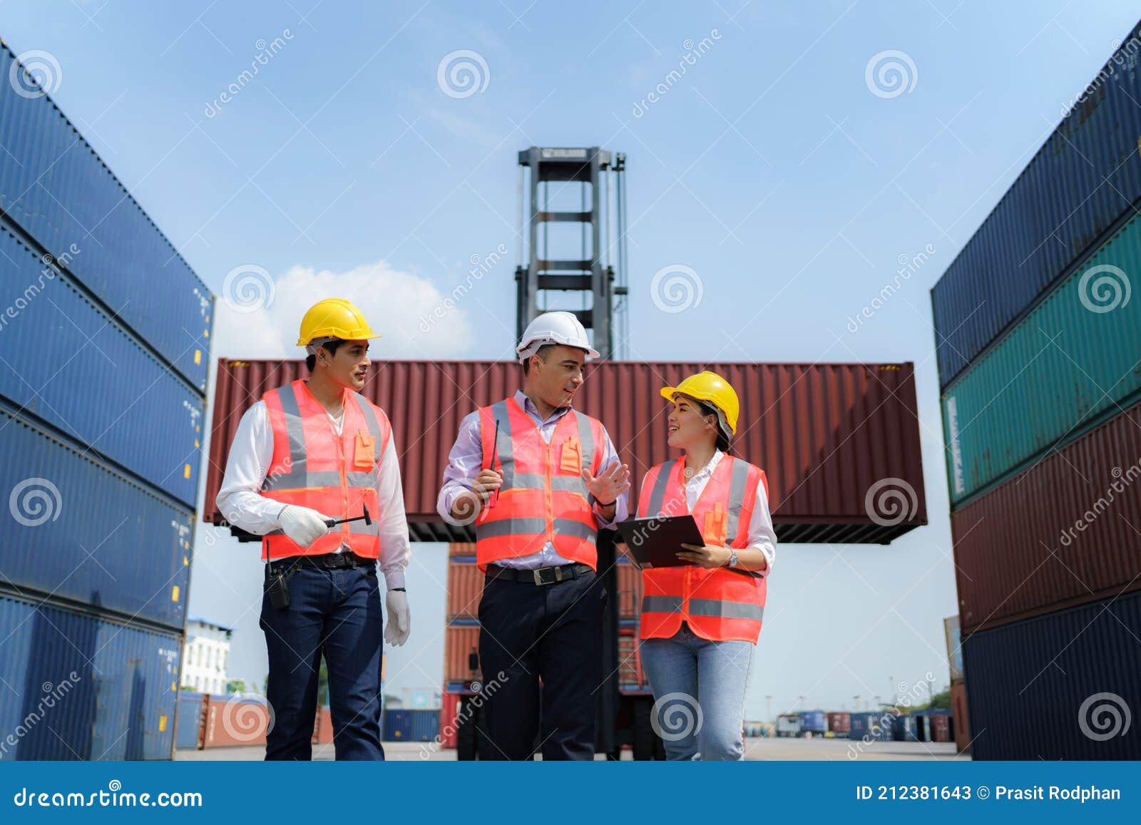 Asian Foreman Walking and Explaining the Various Operations in the ...