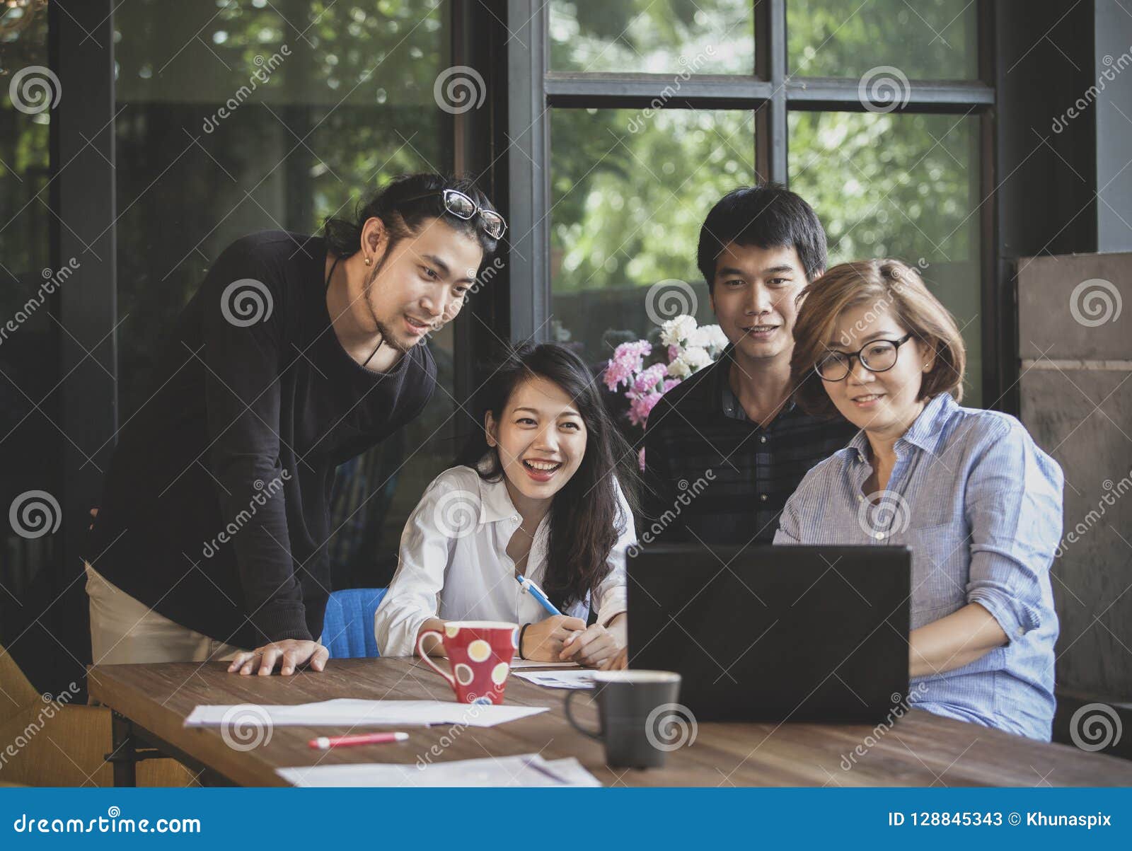 Asian Freelance Team Work Looking To Computer for Project Successful ...