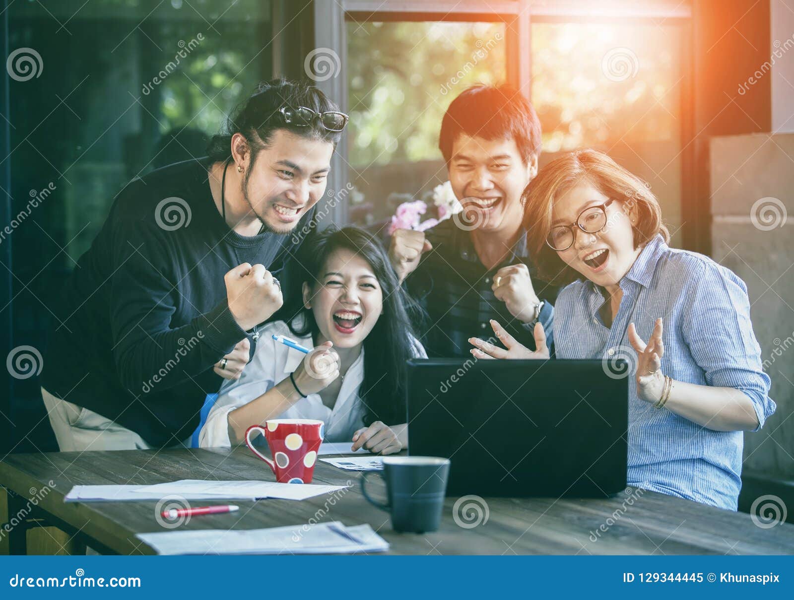 Asian Freelance Teamwork Happiness Emotion Looking To Laptop Com Stock ...