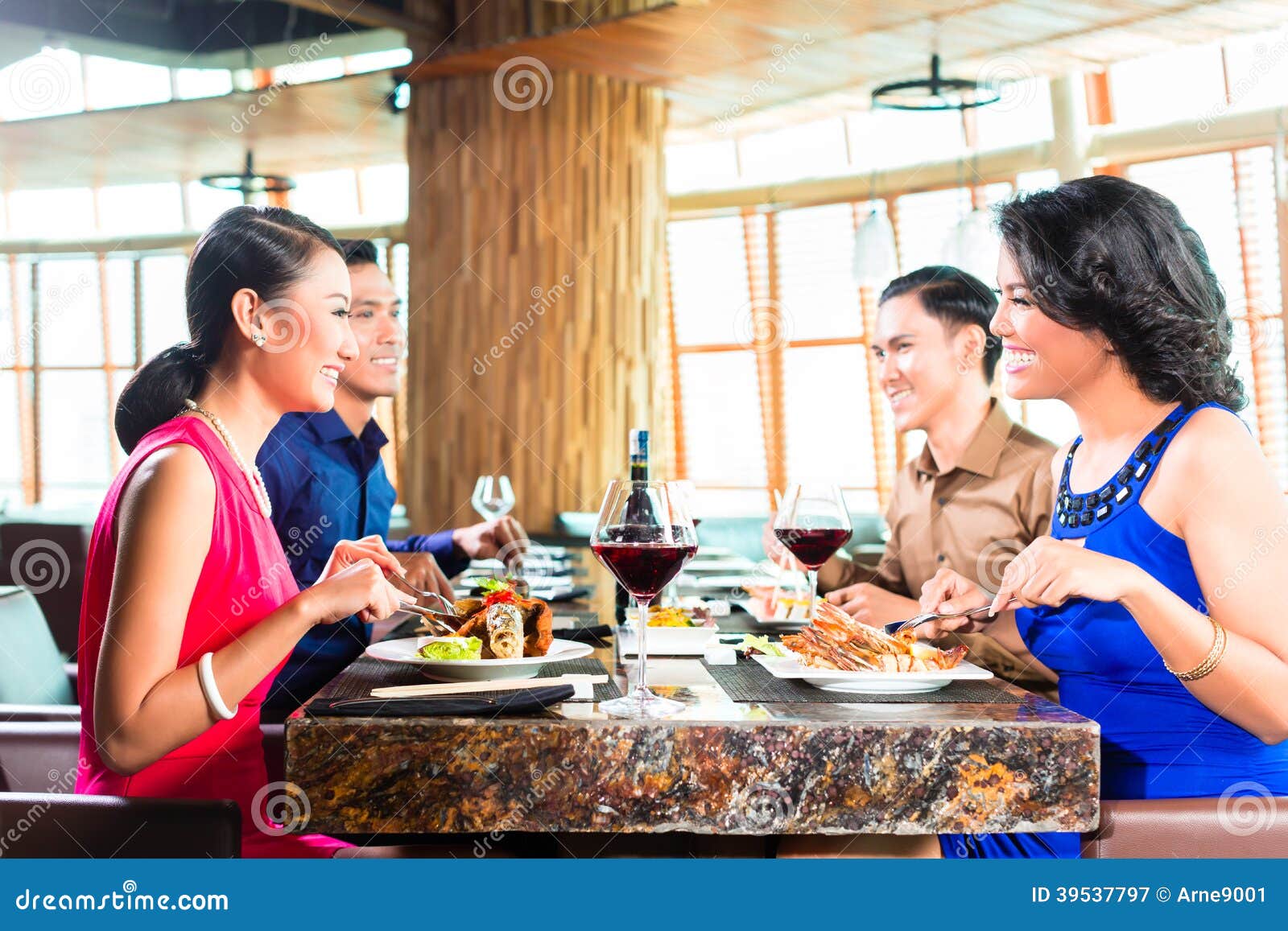 Asian Friends Eating in Restaurant Stock Image - Image of asian, lunch ...