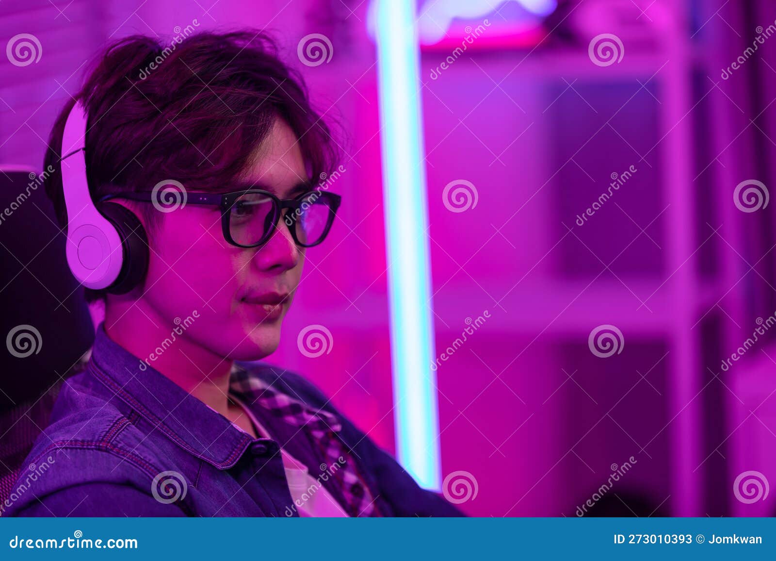 Asian Gamer with a Happy Expression in Front of a Computer Screen ...