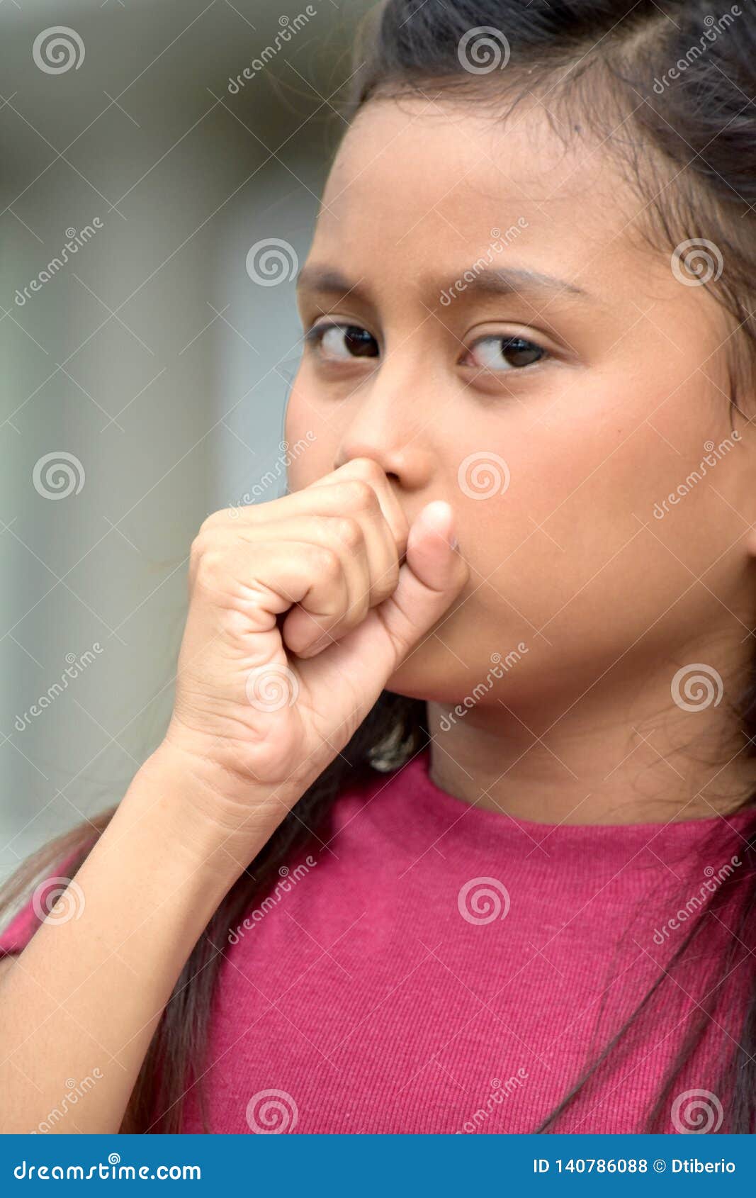 An Asian Girl Coughing stock photo. Image of coughs - 140786088