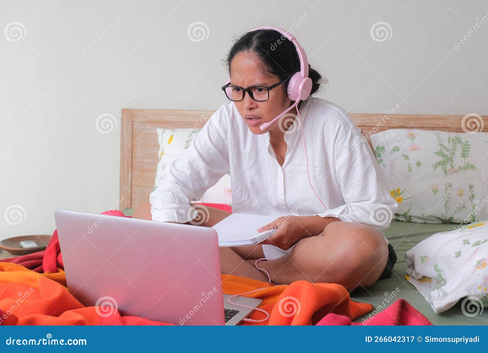 Sadly Surprised Expression of a Girl Working on Her Laptop in Bed Stock ...